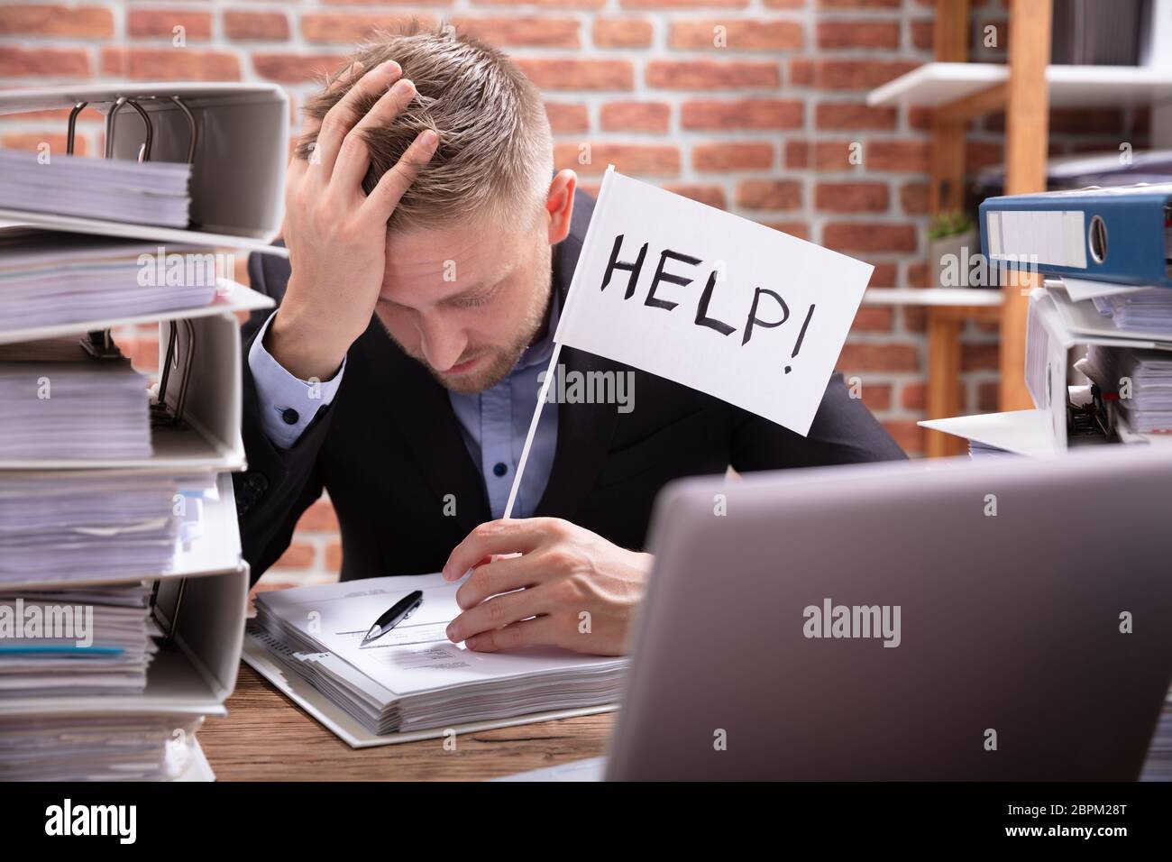 Unhappy Businessman Holding White Help Flag In Office Stock Photo - Alamy
