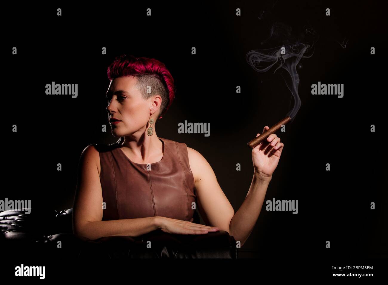 Woman lighting a cigar hi-res stock photography and images - Alamy