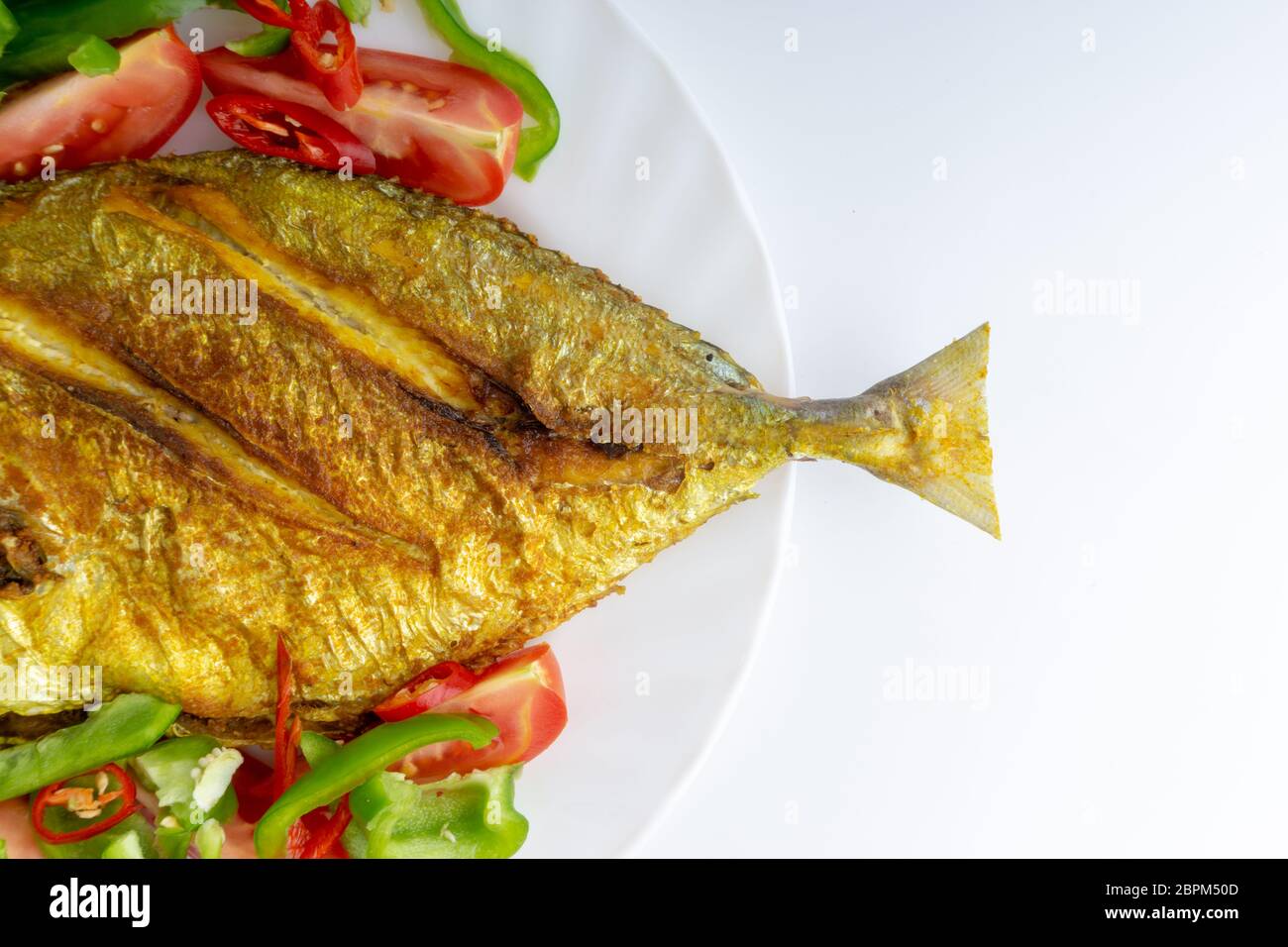 Fried fish on white background with selective focus Stock Photo - Alamy
