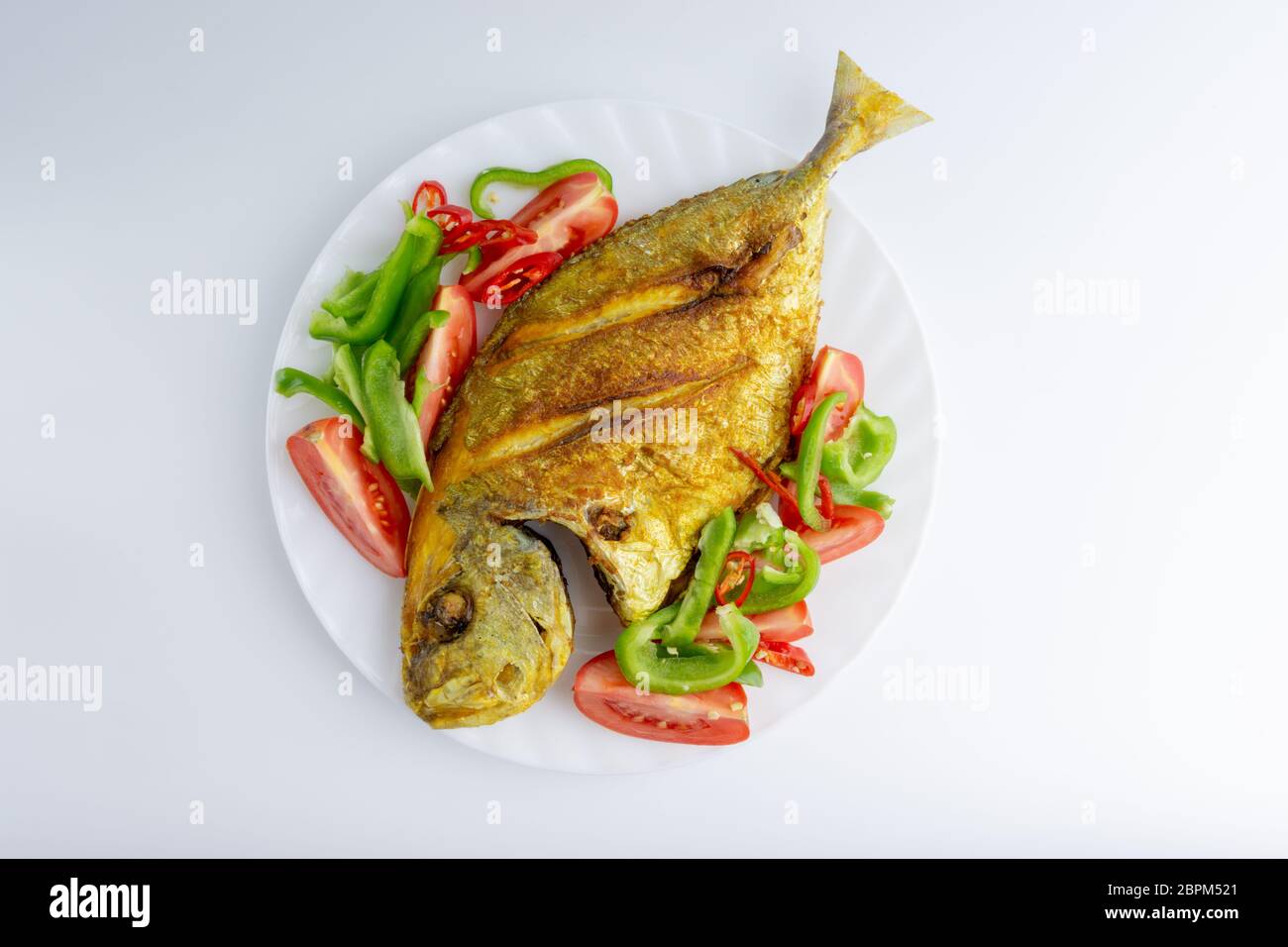 Fried fish on white background with selective focus Stock Photo - Alamy