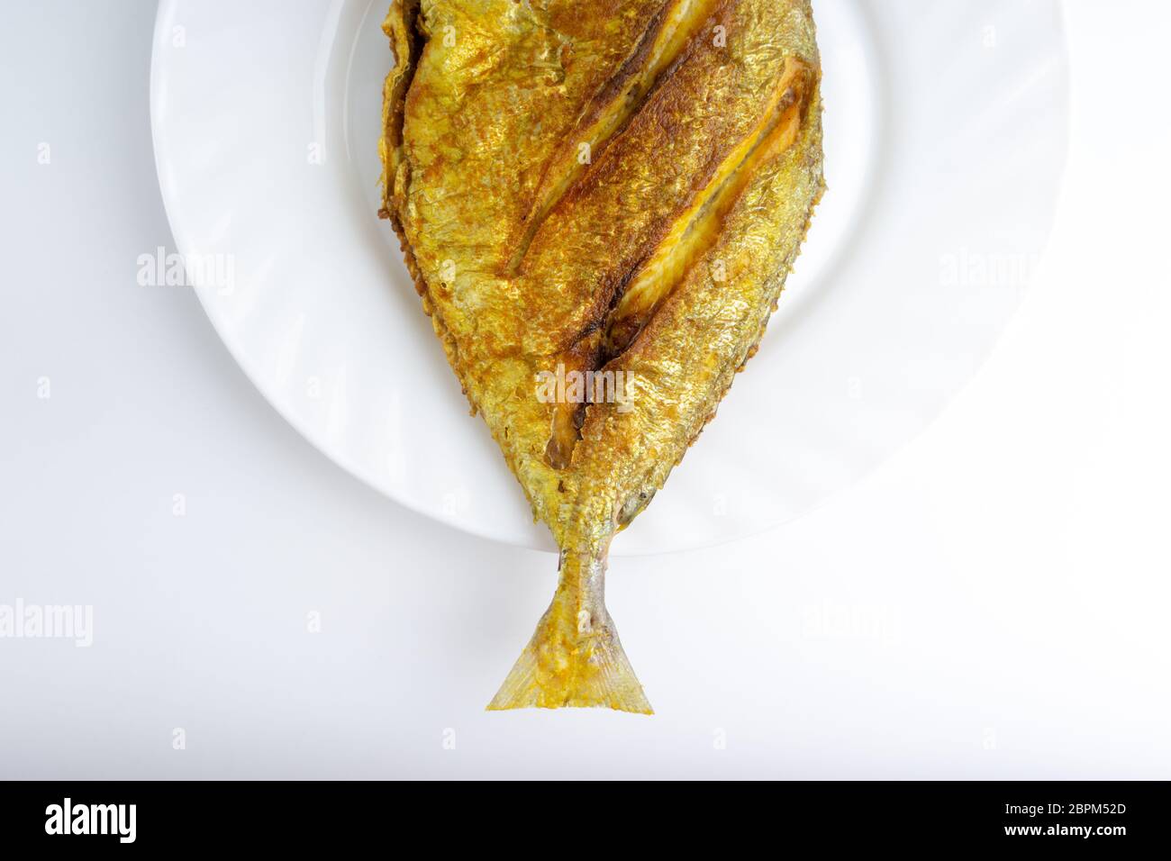 Fried fish on white background with selective focus Stock Photo - Alamy