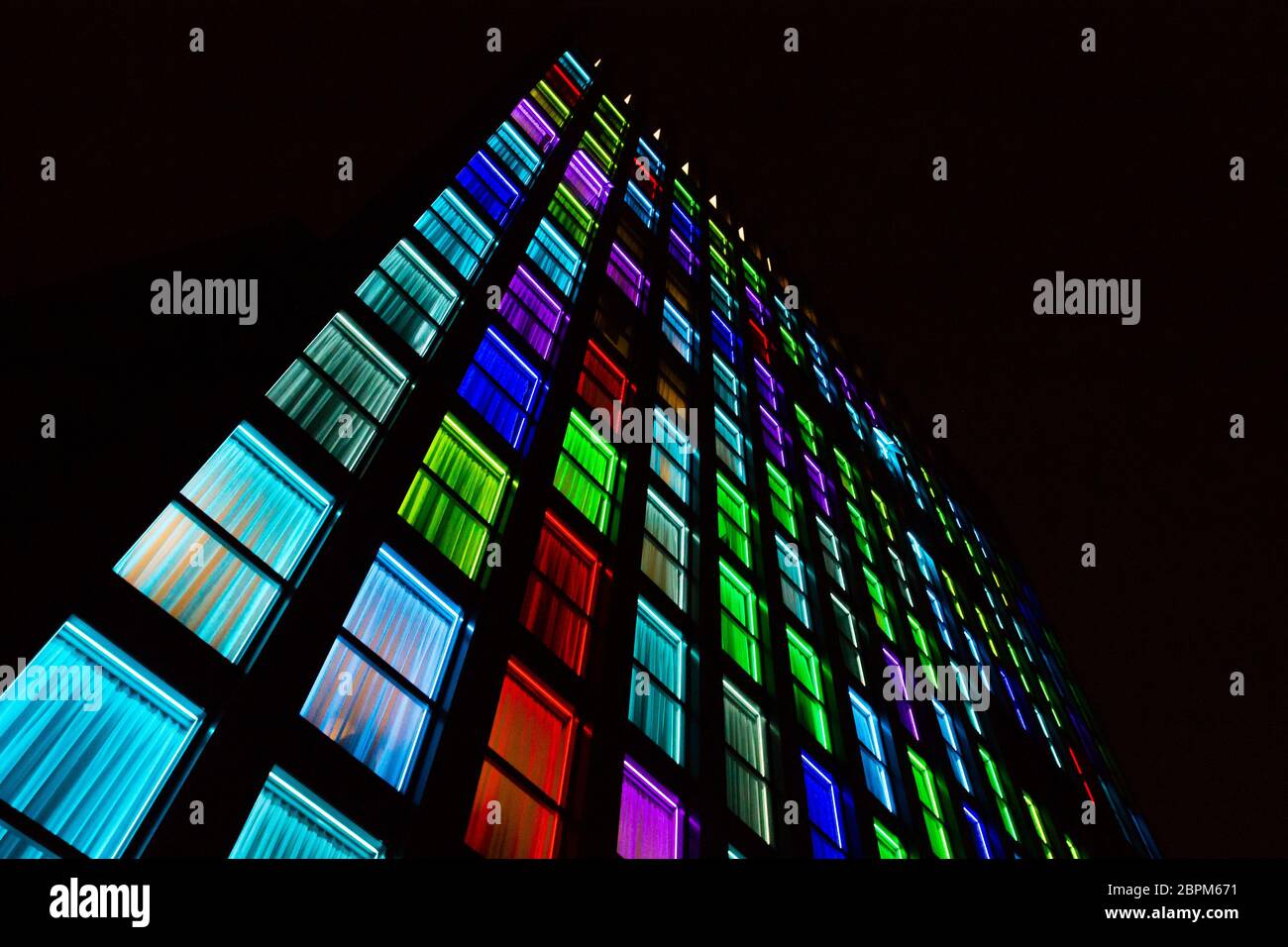 Colored windows texture. Windows illuminated by neon lights background ...