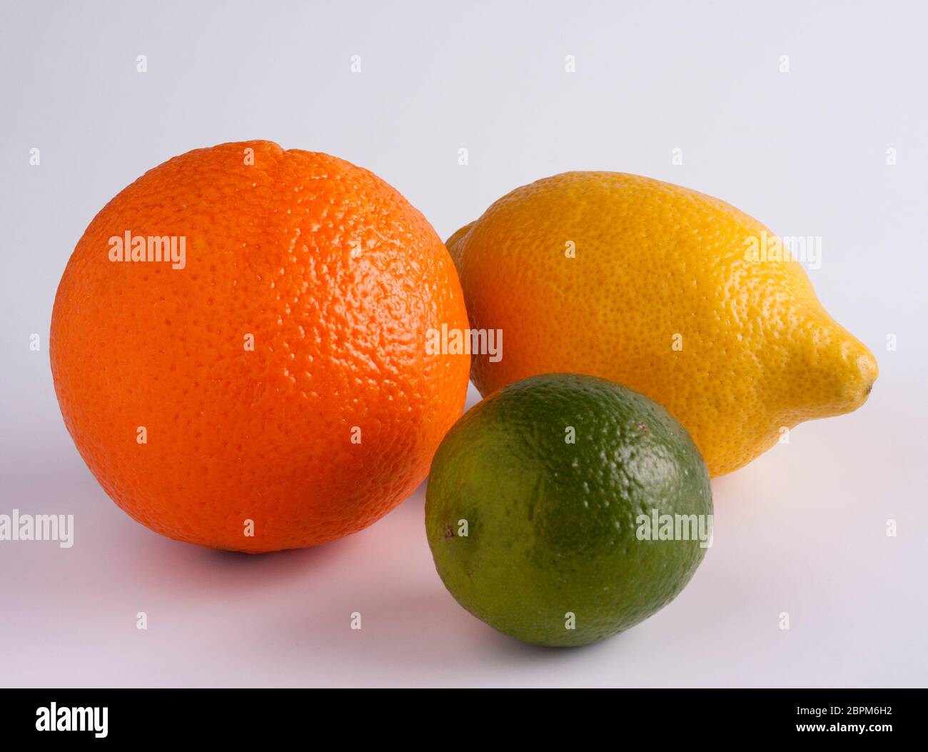Ripe citrus fruits lemon, orange and lime isolated on white background ...