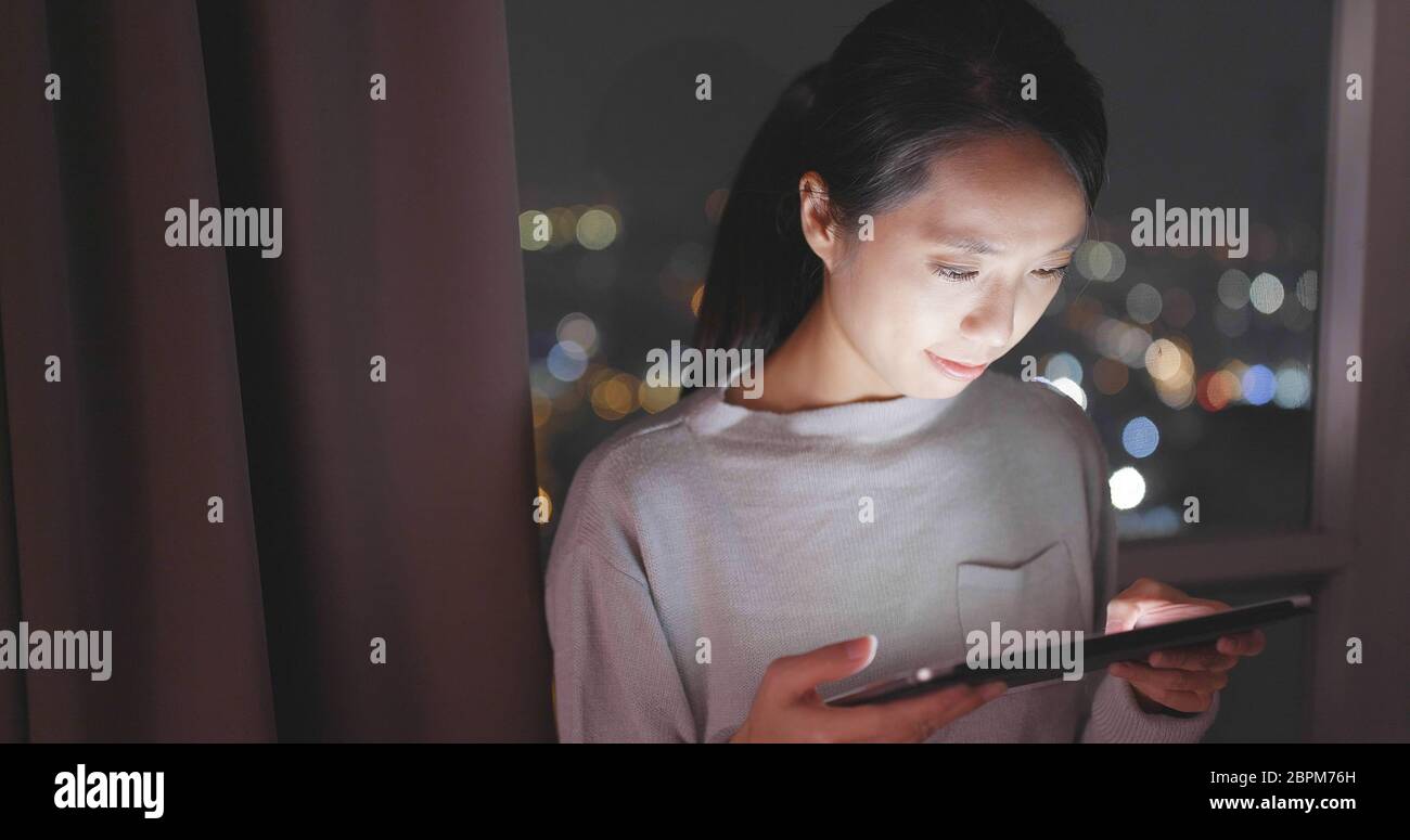 Woman look tablet night hi-res stock photography and images - Alamy