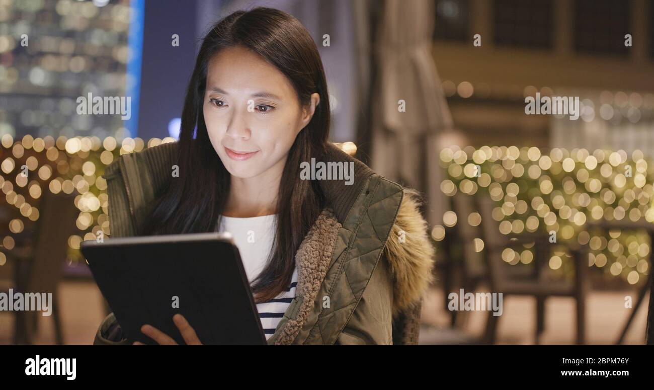Woman look tablet night hi-res stock photography and images - Alamy