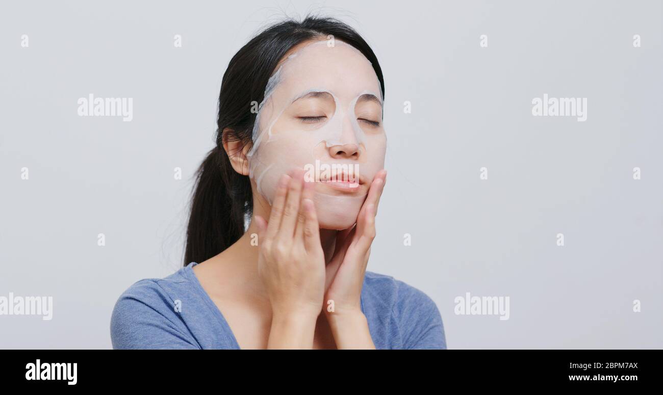 Woman apply face mask Stock Photo - Alamy