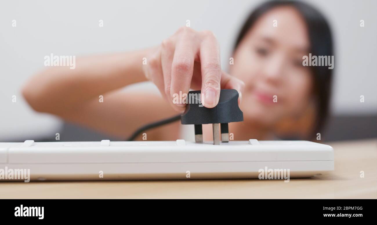 Plug in the power cord on power socket Stock Photo - Alamy