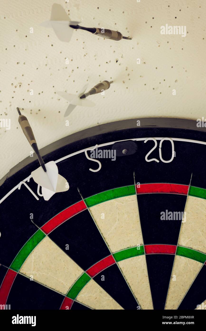 worst darts player in the world thrown all the darts in the wall Stock ...