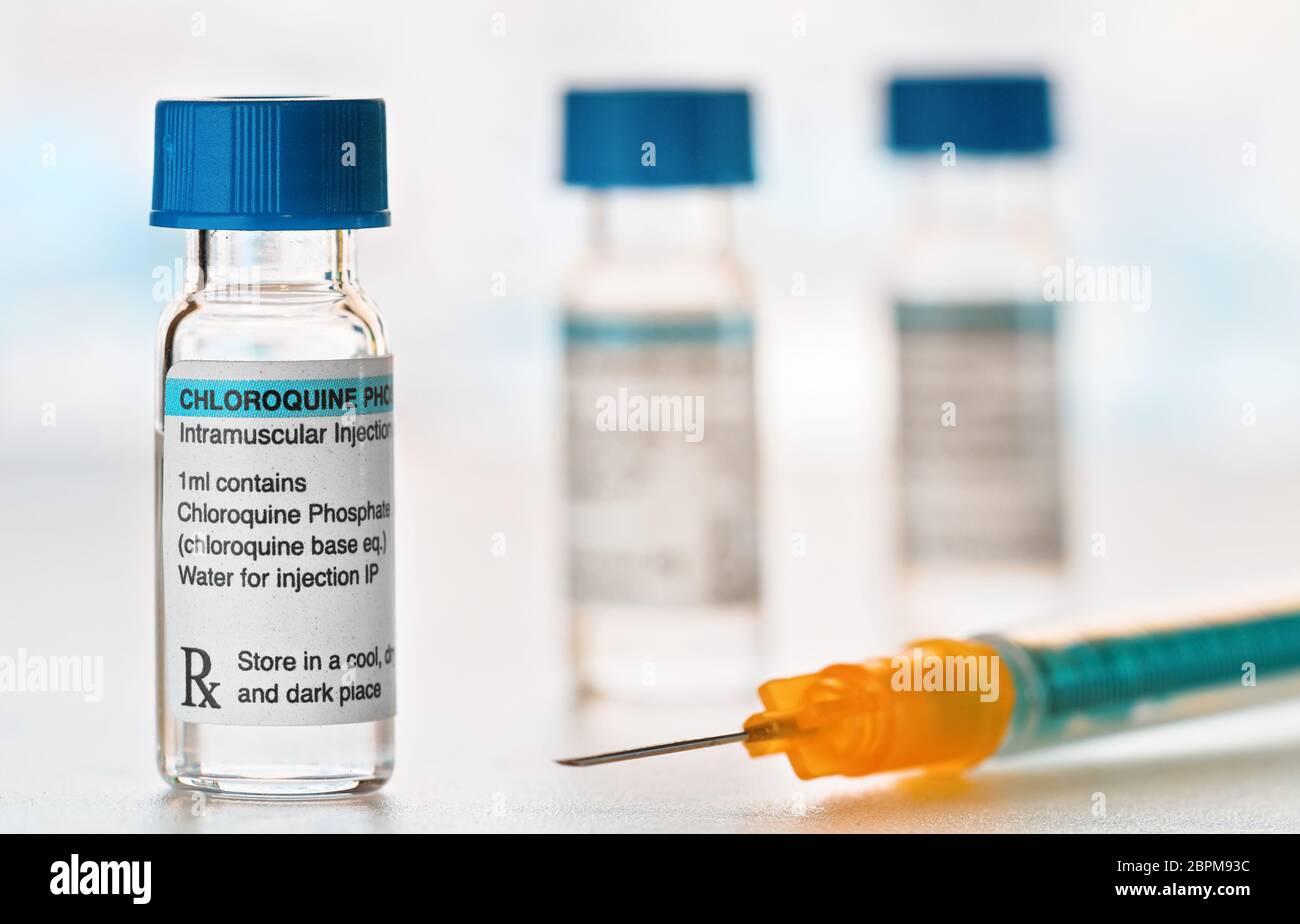Chloroquine phosphate drug in small injection bottles with blue caps ...