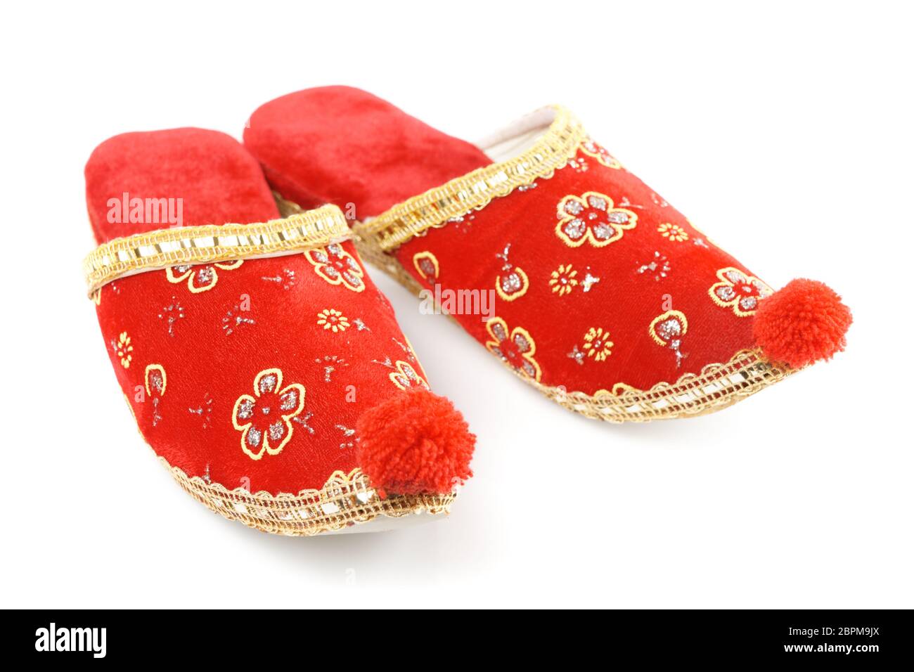 Red embroidered Turkish slippers, decorative footwear isolated on white ...
