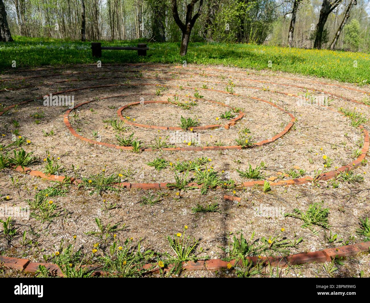 picture with a small spiral formed on the ground Stock Photo - Alamy