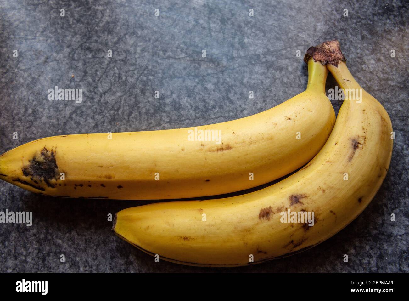 yellow bananas on table Stock Photo - Alamy
