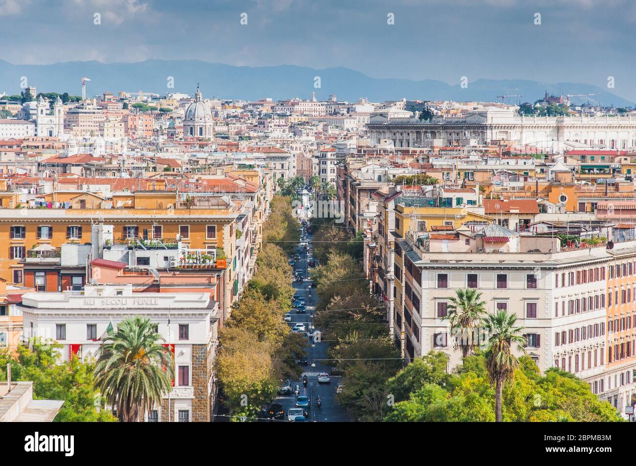 View of a tree-lined avenue on the city of Rome in Italy Stock Photo ...