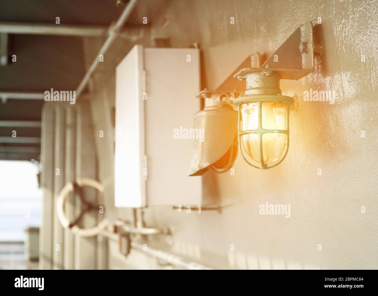 Deck lamp on ship with metal frame fixed in protective cage Stock Photo ...