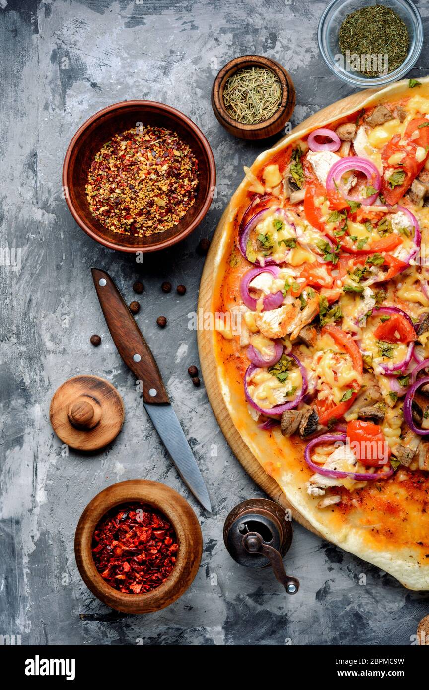 Italian oizza with meat,tomatoes and mushrooms.Fast food Stock Photo ...