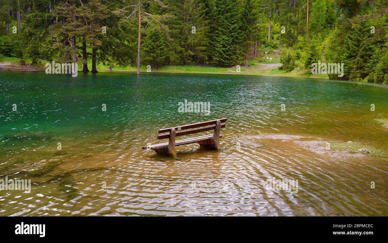 Scenic view of a bench in lake Stock Photo - Alamy