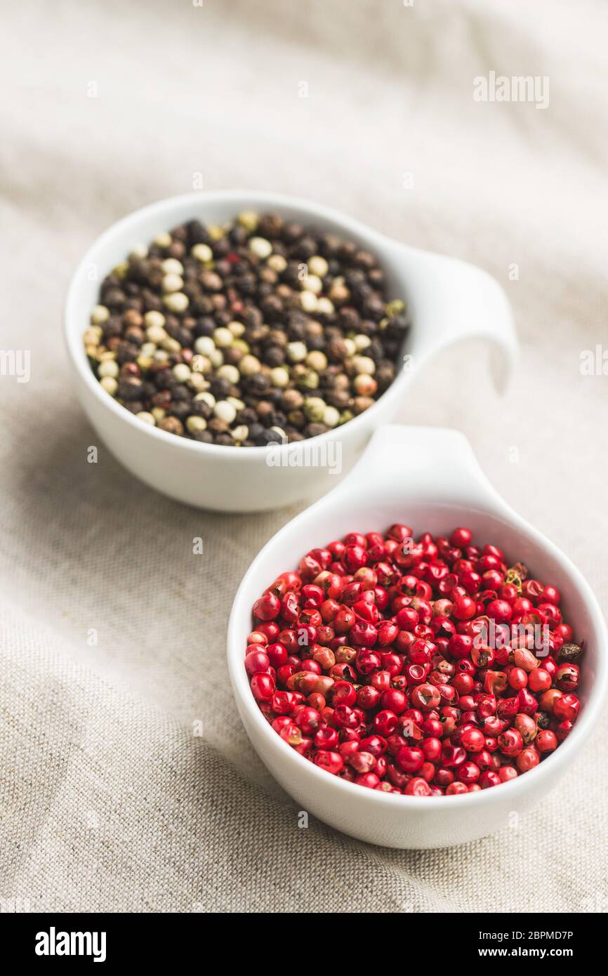 Different types of dried peppercorn in bowl Stock Photo - Alamy