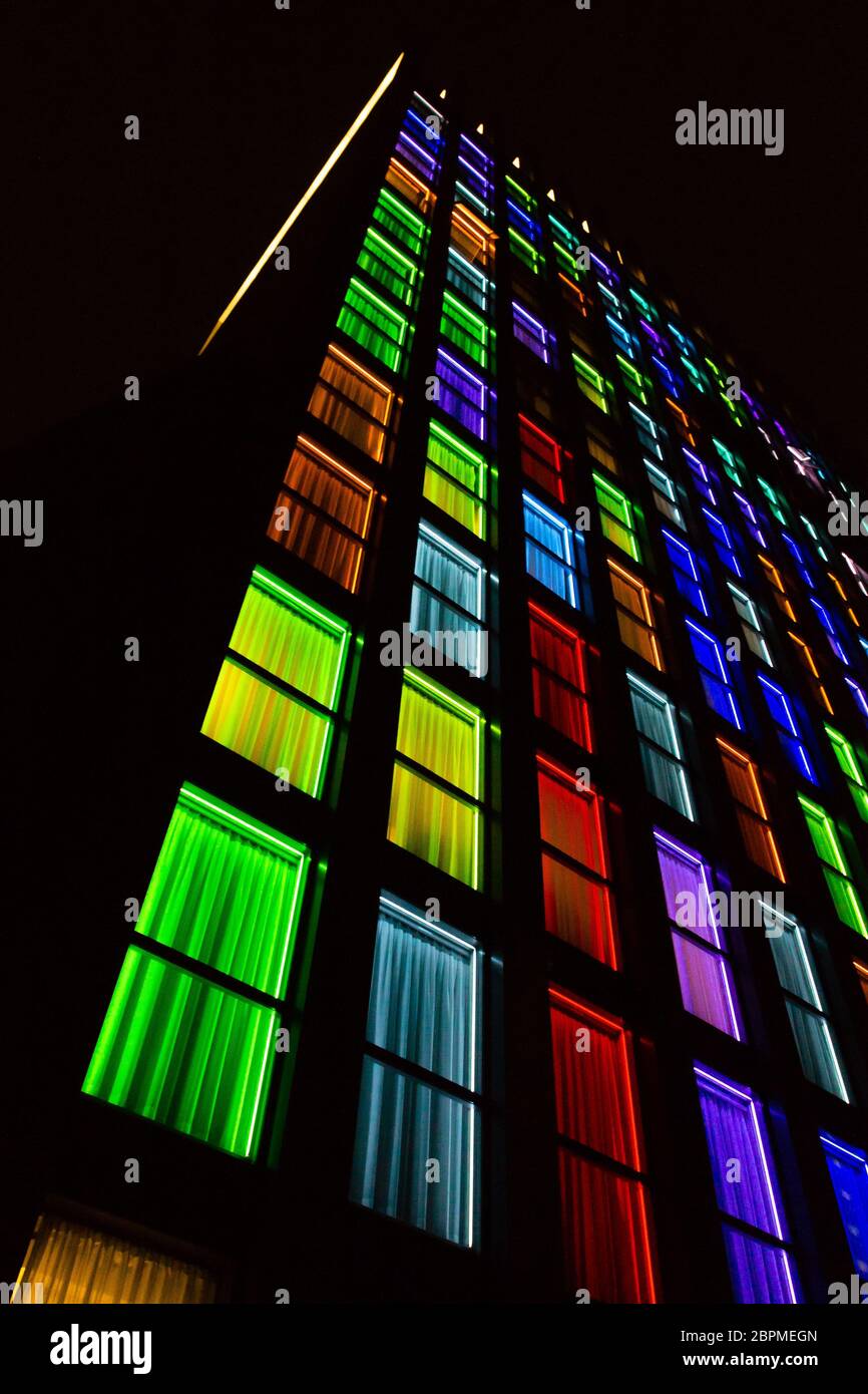 Colored windows texture. Windows illuminated by neon lights background ...