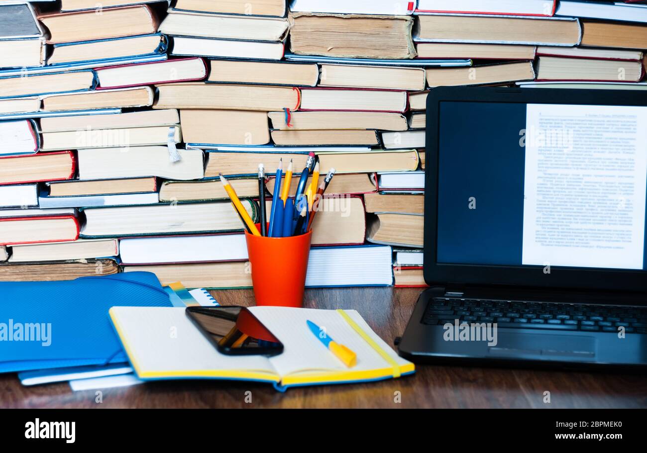Textbook, notebook, laptop computer, mobile phone smartphone, stack of ...