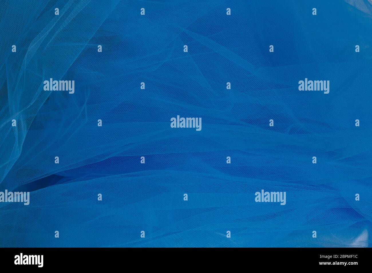 Texture of crumpled blue tulle fabric Stock Photo - Alamy