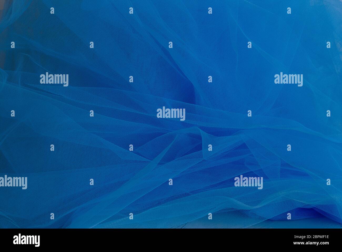 Texture of crumpled blue tulle fabric Stock Photo - Alamy