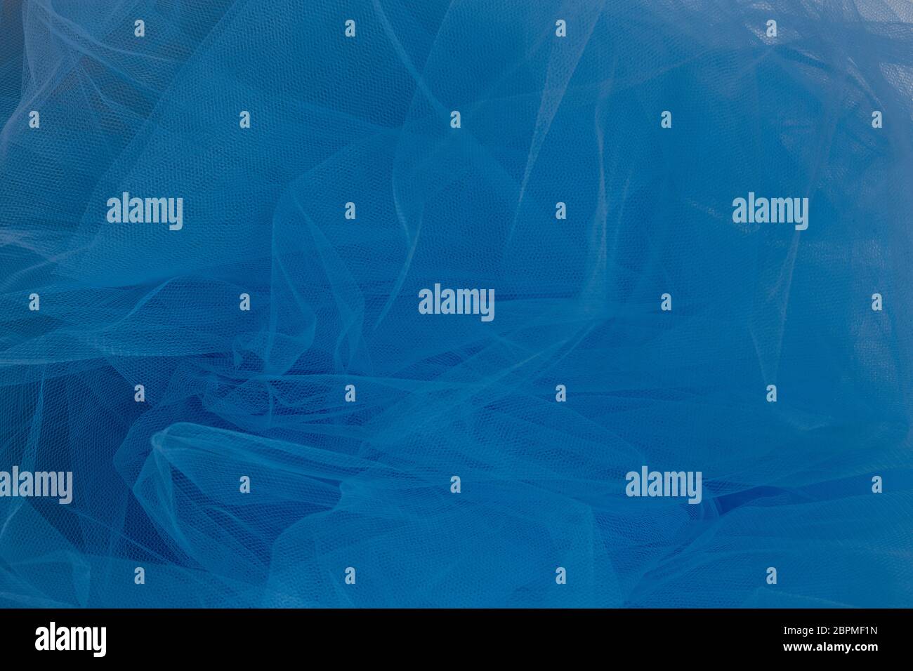 Texture of crumpled blue tulle fabric Stock Photo - Alamy