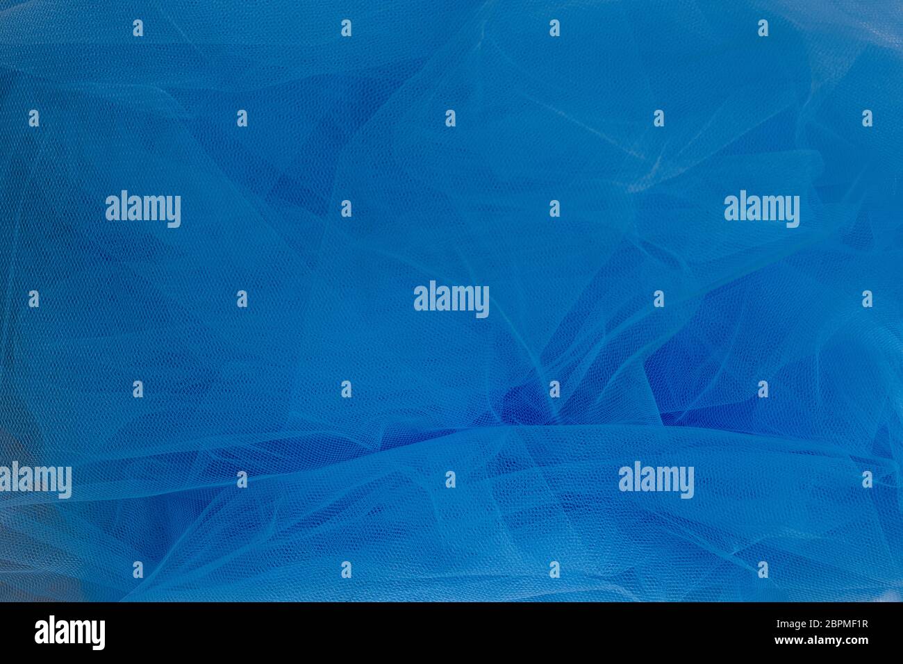 Texture of crumpled blue tulle fabric Stock Photo - Alamy