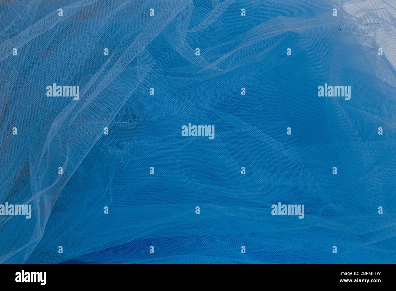 Texture of crumpled blue tulle fabric Stock Photo - Alamy