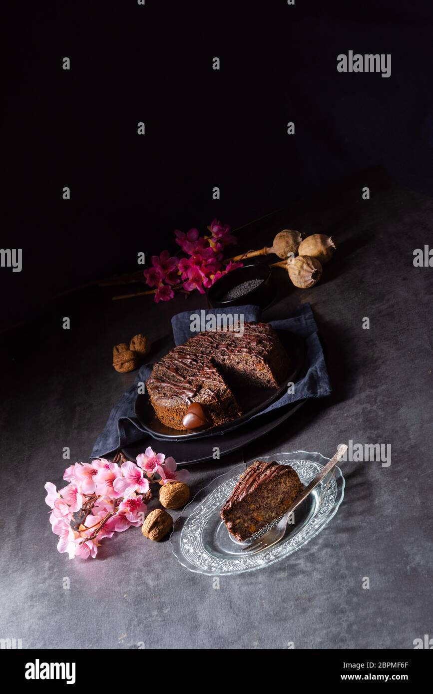 juicy poppy seed cake with apples and chocolate glaze Stock Photo - Alamy