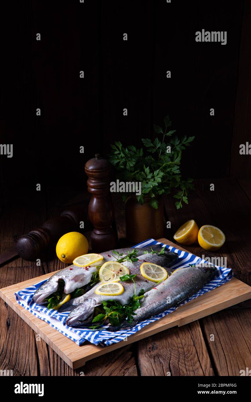 fresh trout with lemon and different herbs Stock Photo - Alamy