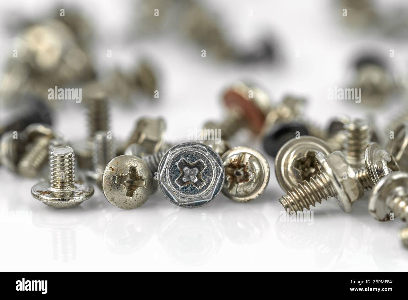 Set of old screws on the white background Stock Photo - Alamy