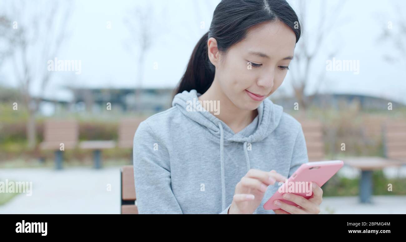 Woman use of mobile phone for online Stock Photo - Alamy