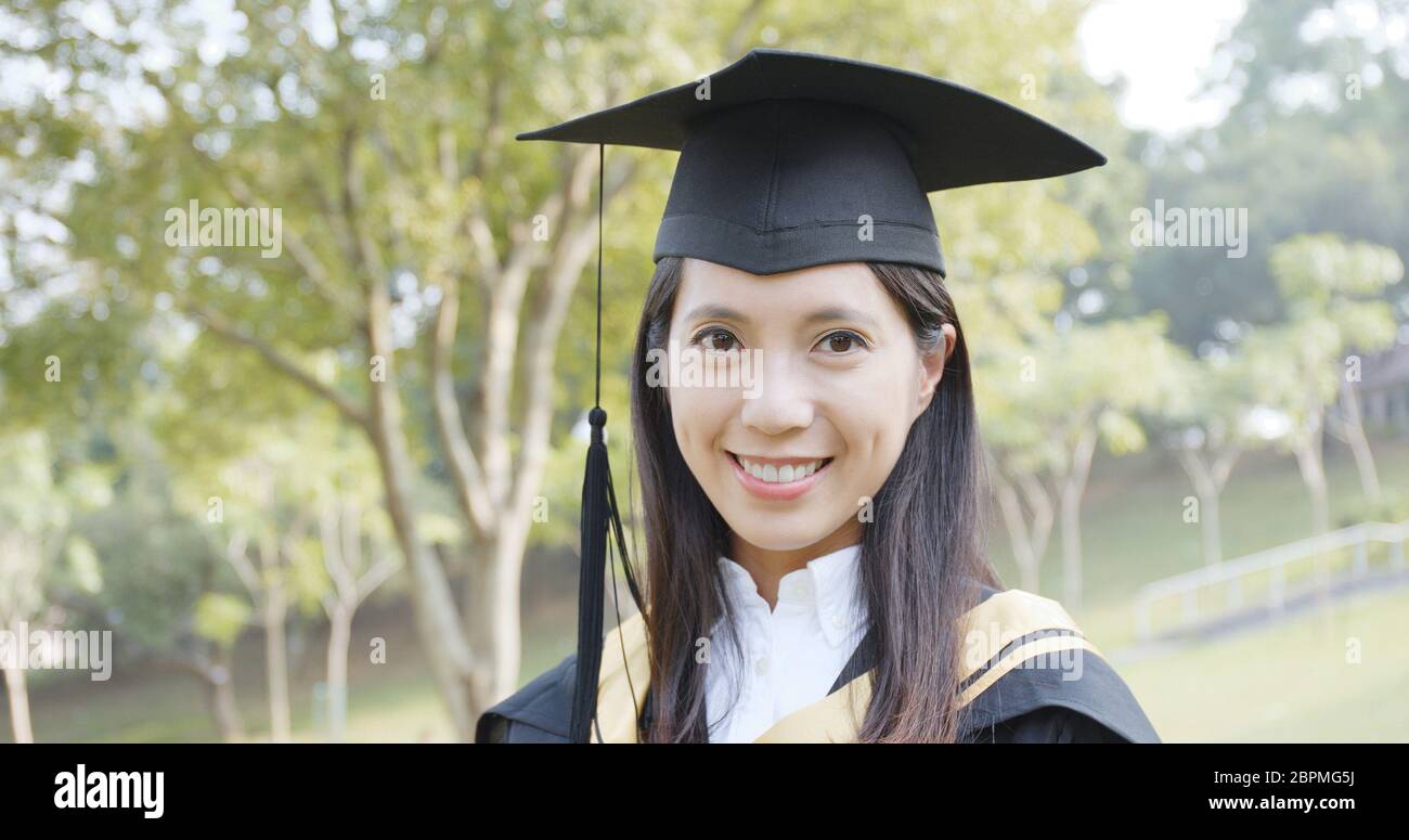Graduated young woman Stock Photo - Alamy