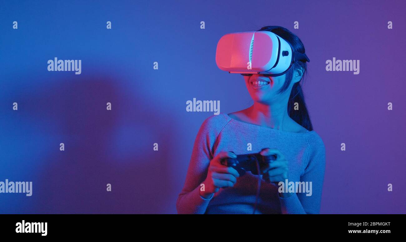 Woman using virtual reality controller hi-res stock photography and ...