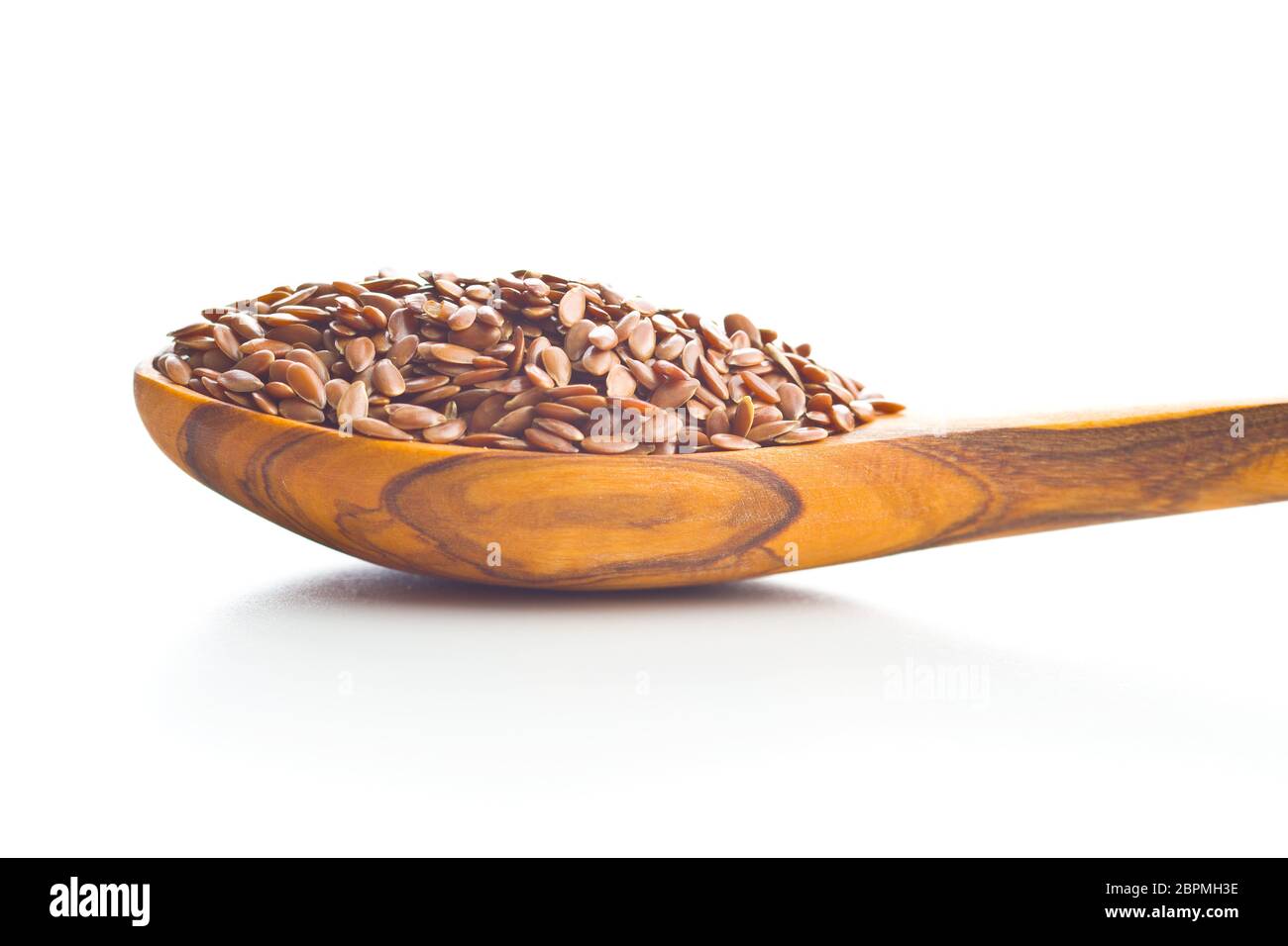 Flax seeds, linen seeds or linseeds in spoon isolated on white background Stock Photo - Alamy
