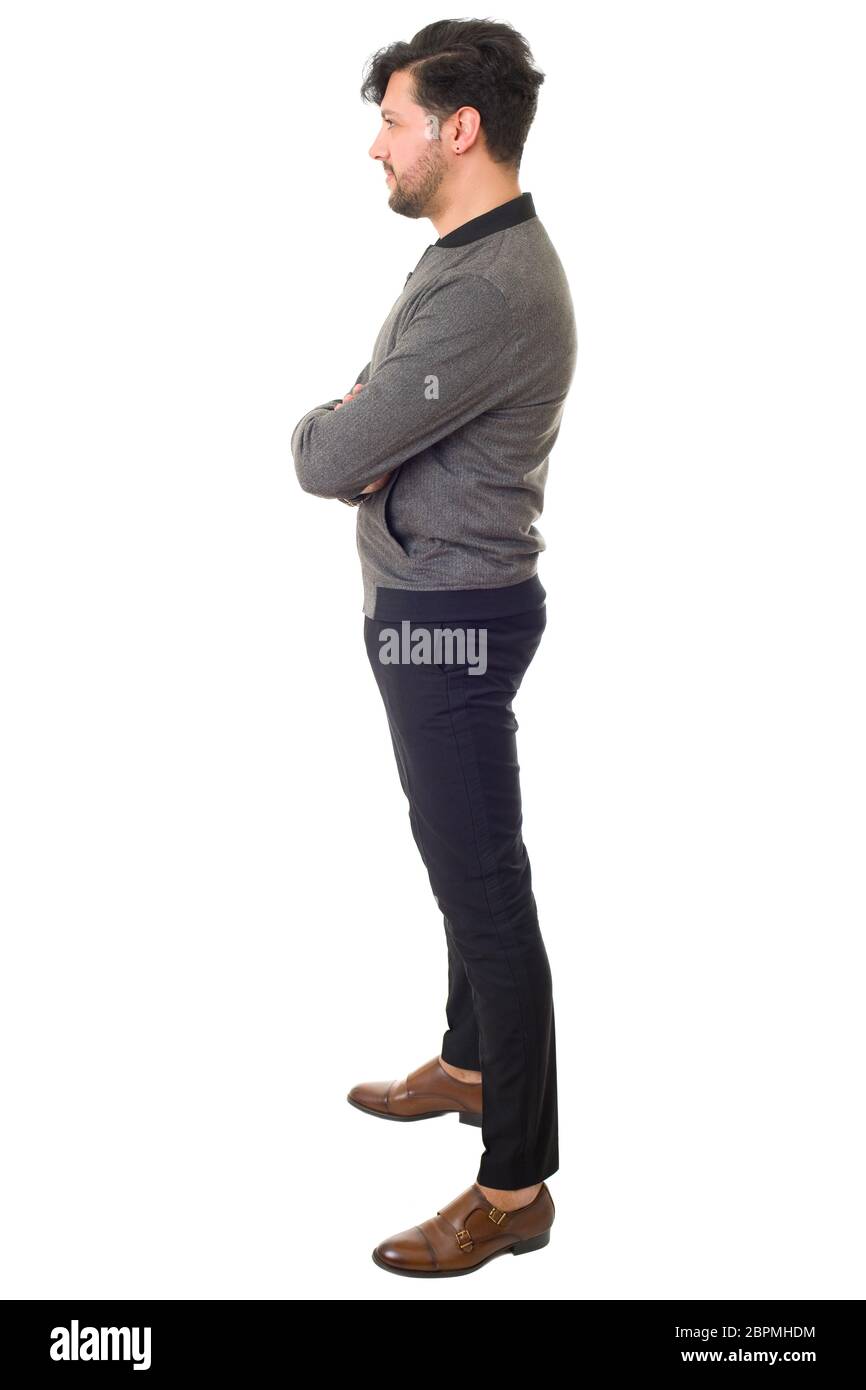 young casual man full body from the side in a white background Stock ...