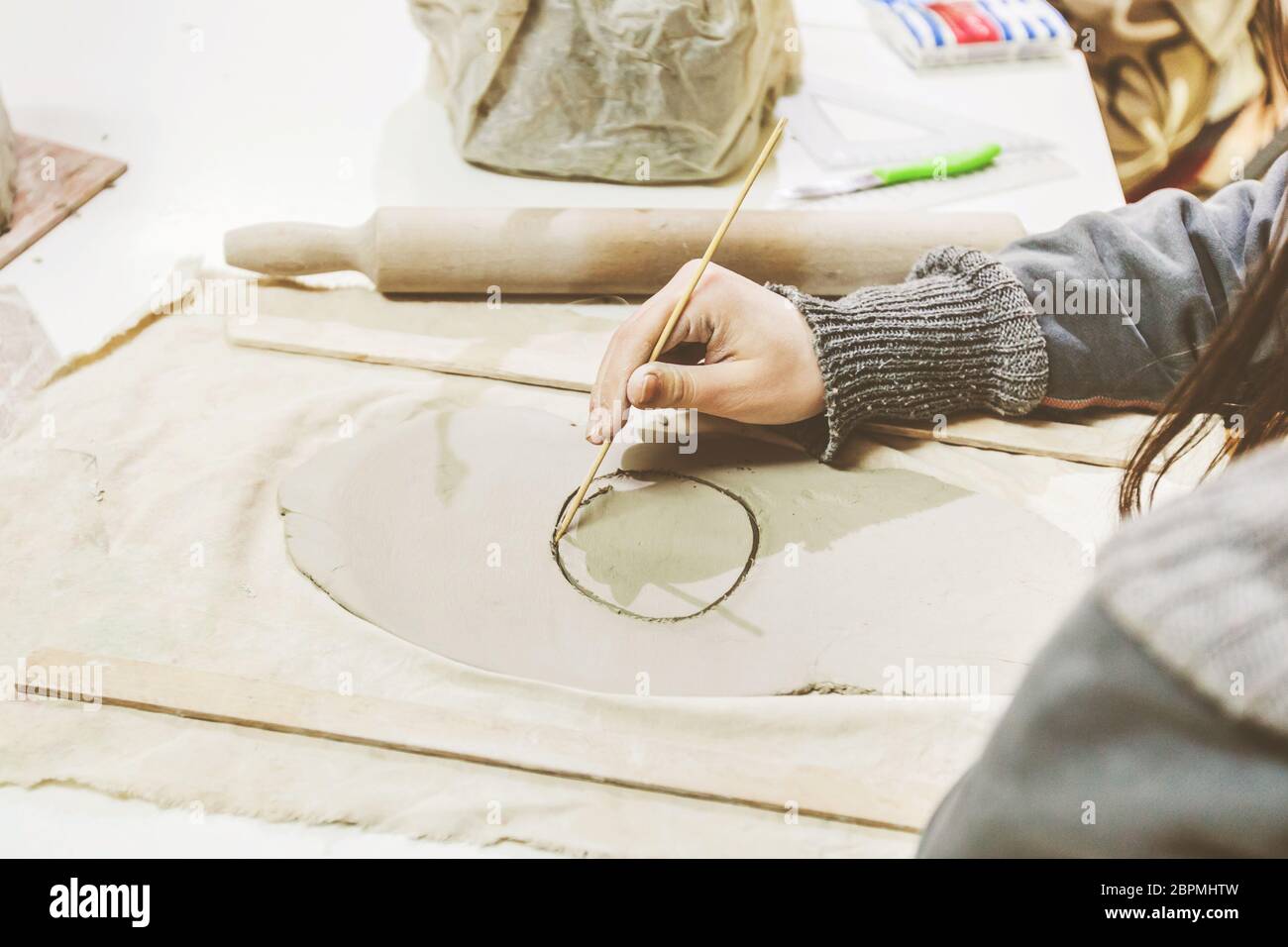 Little artist hands working with clay at pottery workshop Stock Photo ...