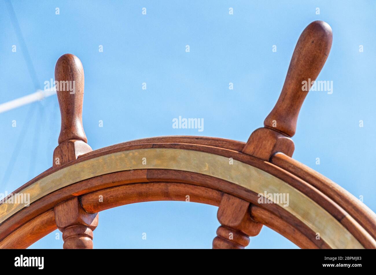 The wooden steering wheel on a sailing ship Stock Photo - Alamy