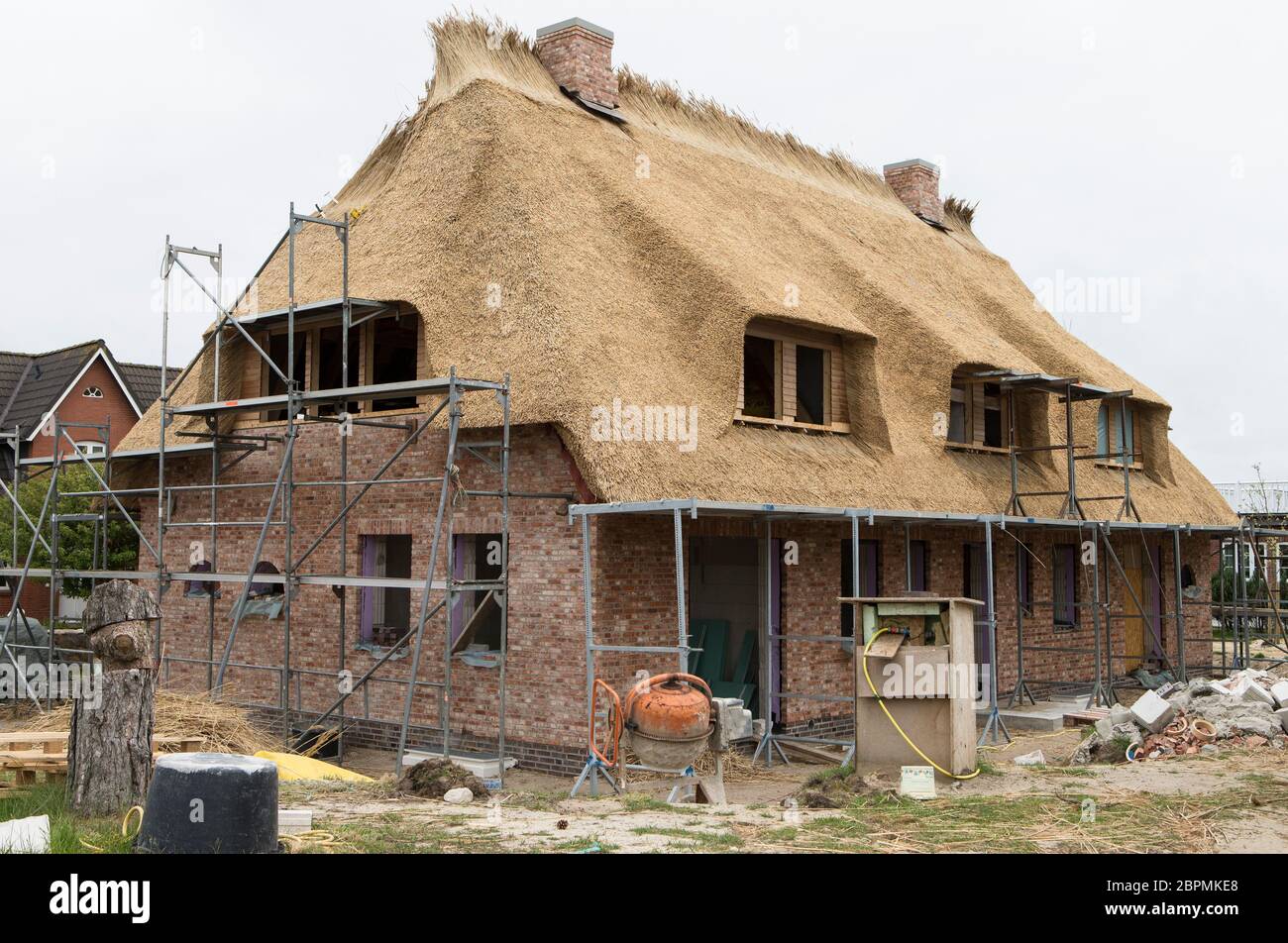 The photo shows a traditional reed roof house in raw construction Stock ...