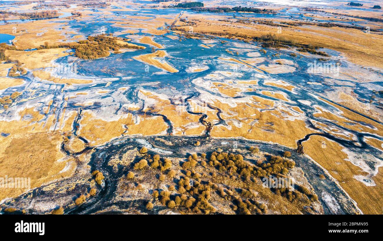 Spring rural aerial landscape. Frozen winter river. Spring melting ...