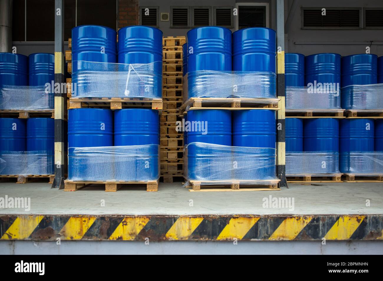 Toxic waste/chemicals stored in barrels at a plant - cans with ...