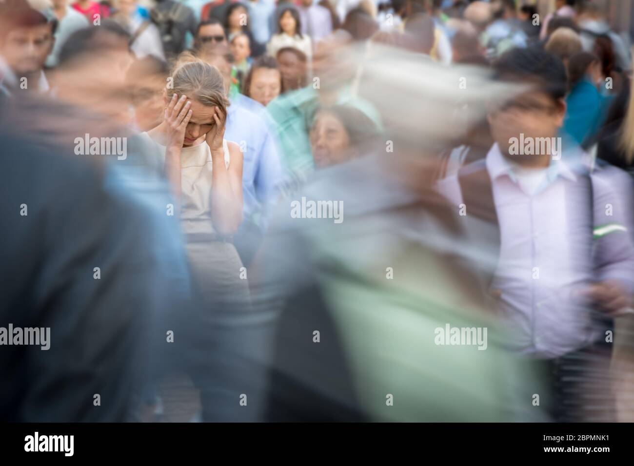 Woman alone in crowd hi-res stock photography and images - Alamy