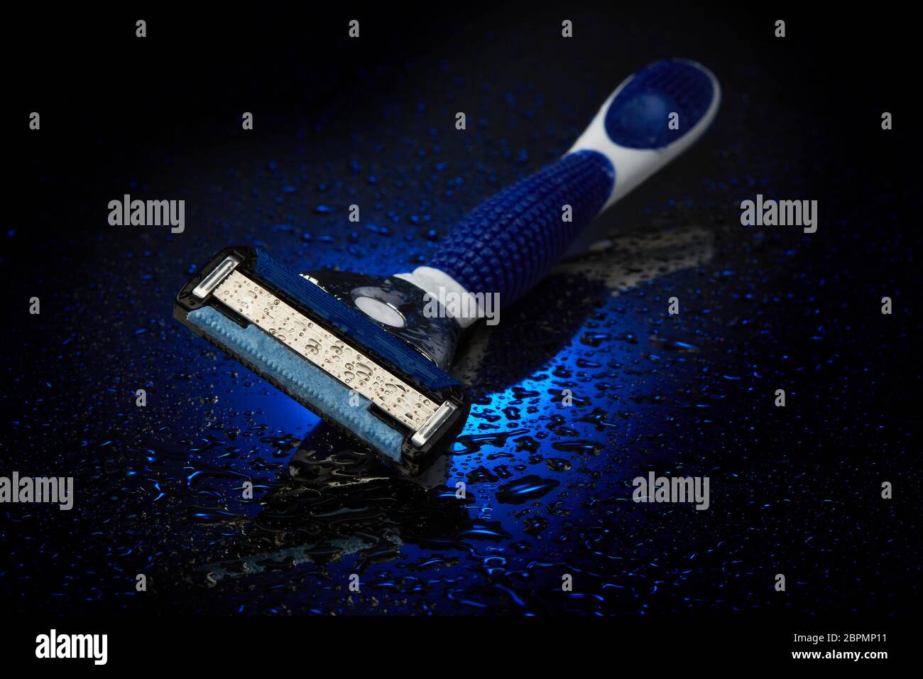 Modern blue razor for men on black background with blue lighting and ...