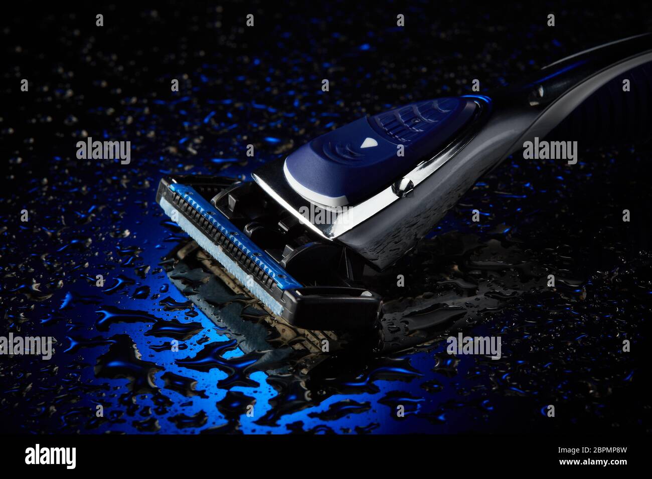 Modern blue razor for men on black background with blue lighting and ...