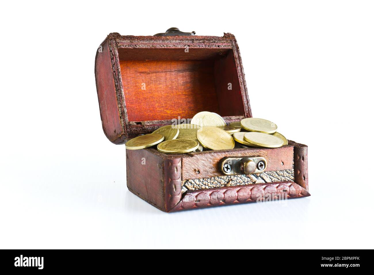 Treasure chest filled with gold coins isolated on white background ...
