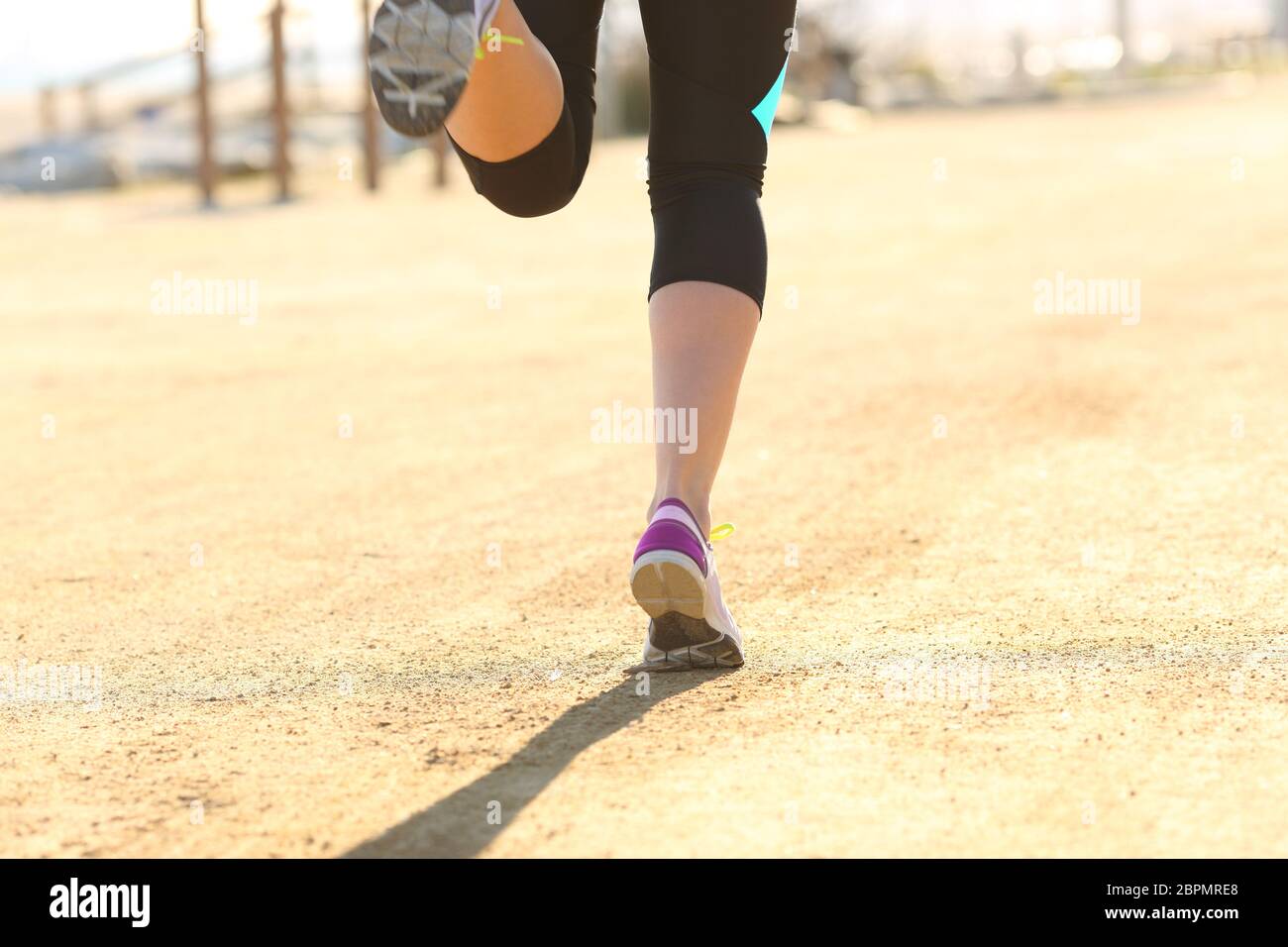 Back view portrait of runner legs running outdoors Stock Photo - Alamy