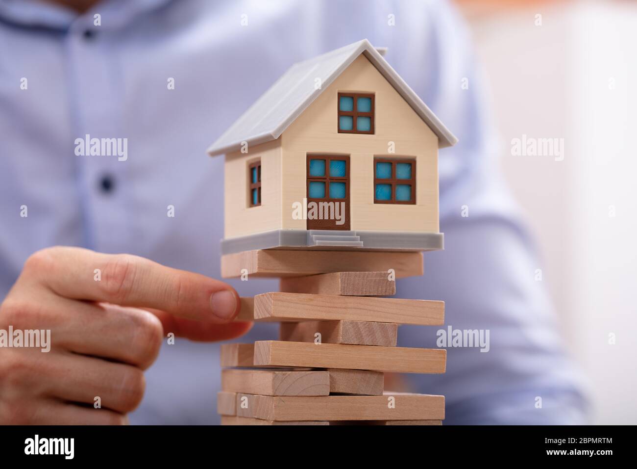 Man building up house building blocks hi-res stock photography and ...