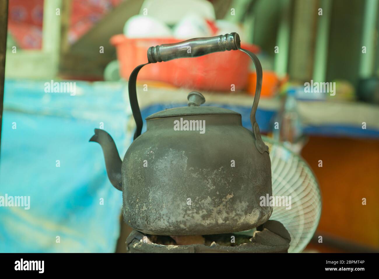 old teapot in soot, boil water, black soot Stock Photo - Alamy