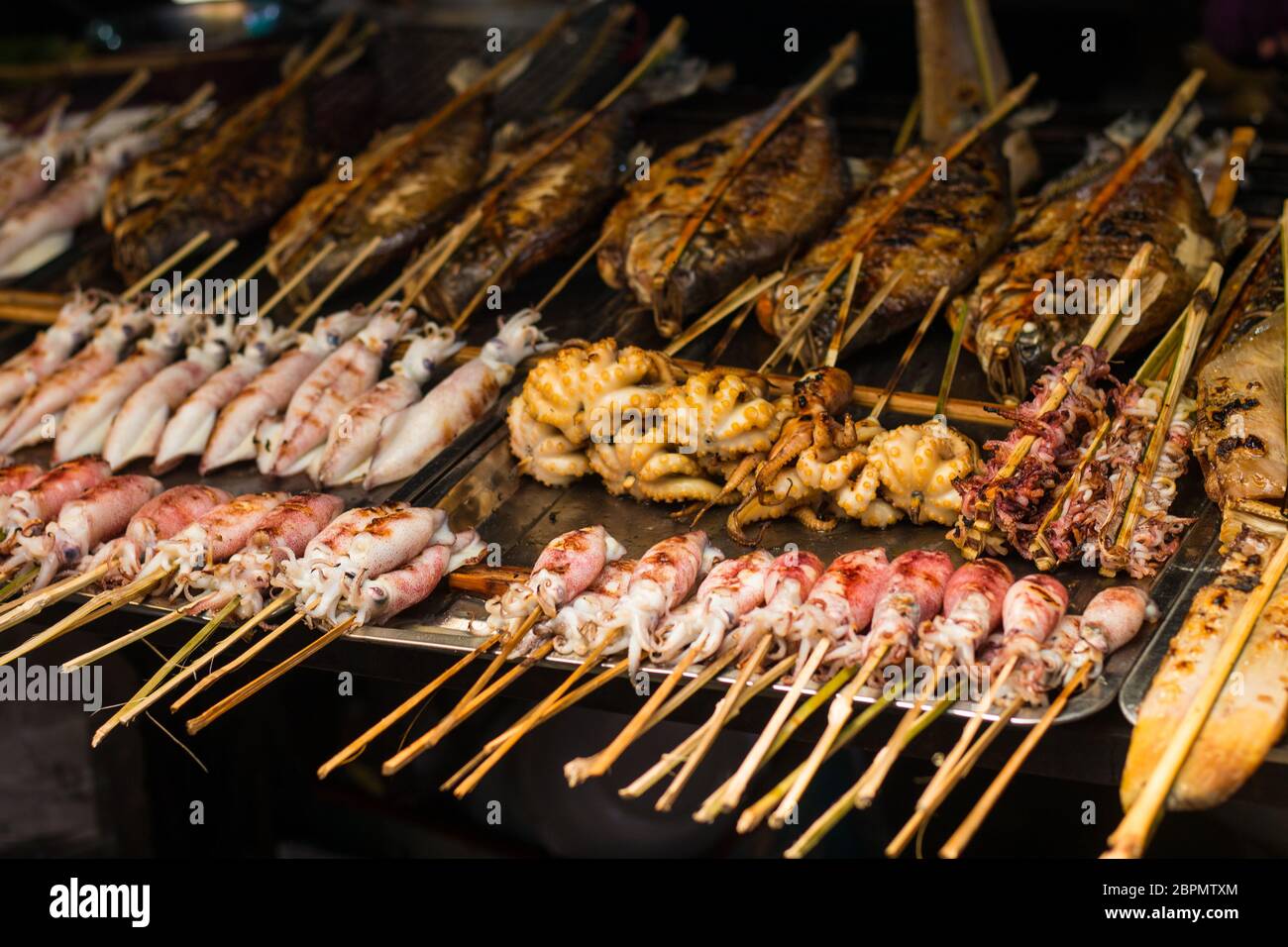 Fresh fish street market on the river in South Asia, meat, and fish are ...
