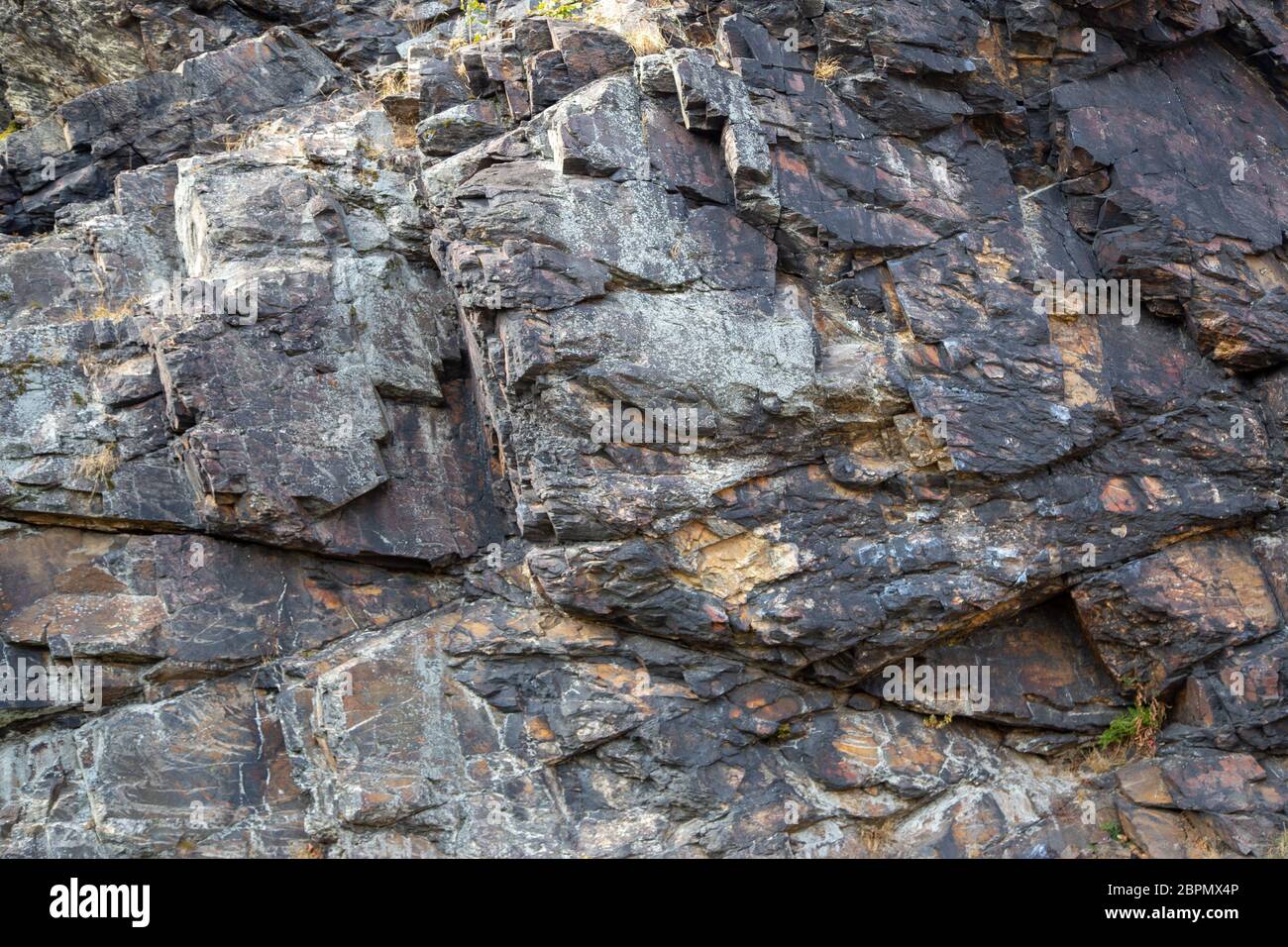 a grey rock face in the sun Stock Photo - Alamy